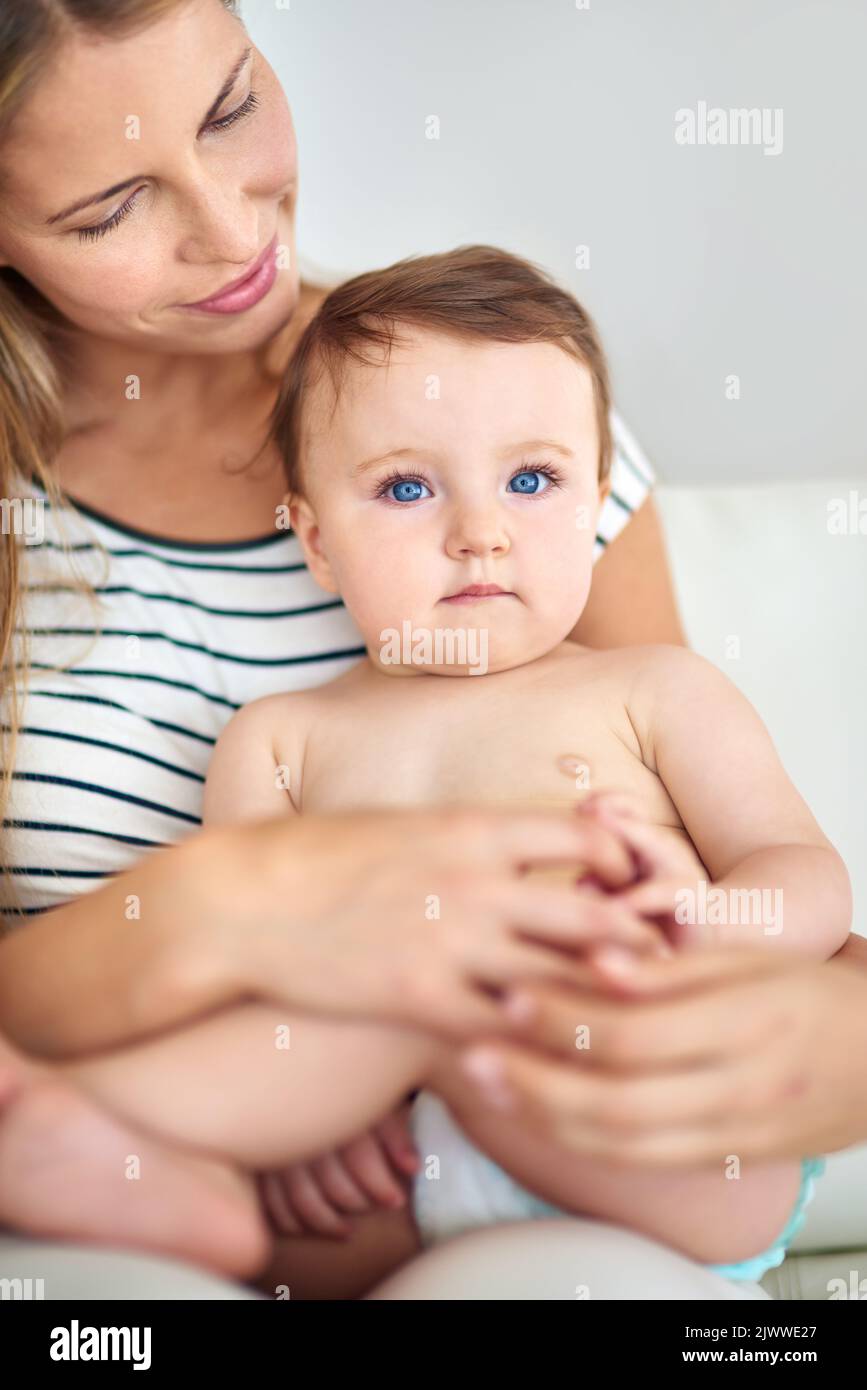 No better place to be than in Moms arms. a mother bonding with her ...