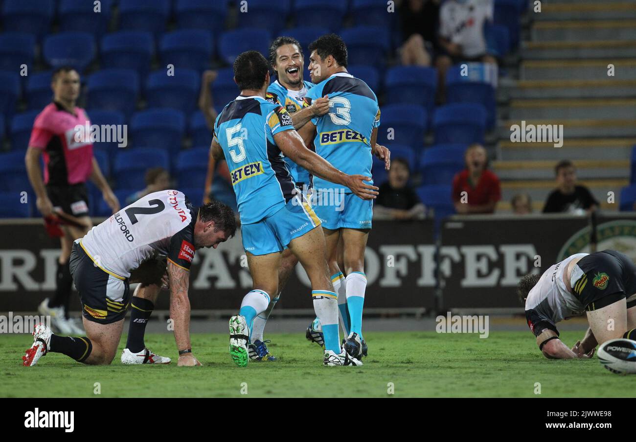 Titans David Mead, Gordon and Brad Tighe celebrate Tighe's winning try ...