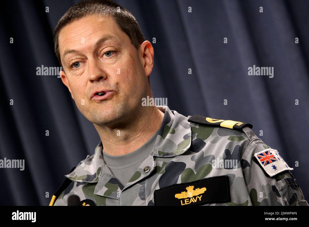 Commodore Peter Leavy from the Australian Navy talking at a press ...