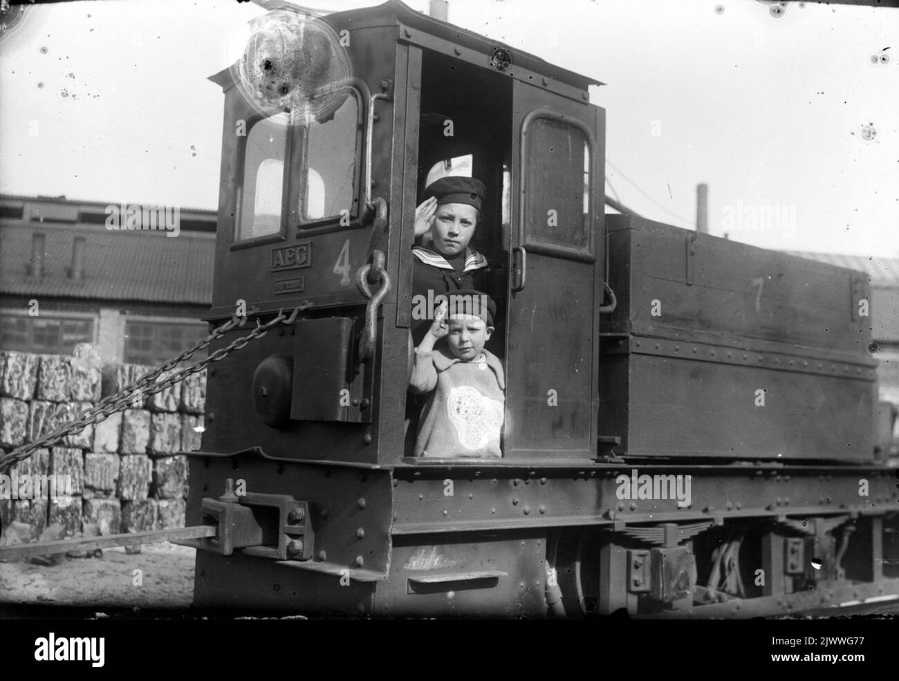 Two boys in AEG locomotive. Två pojkar i AEG-lok Stock Photo - Alamy