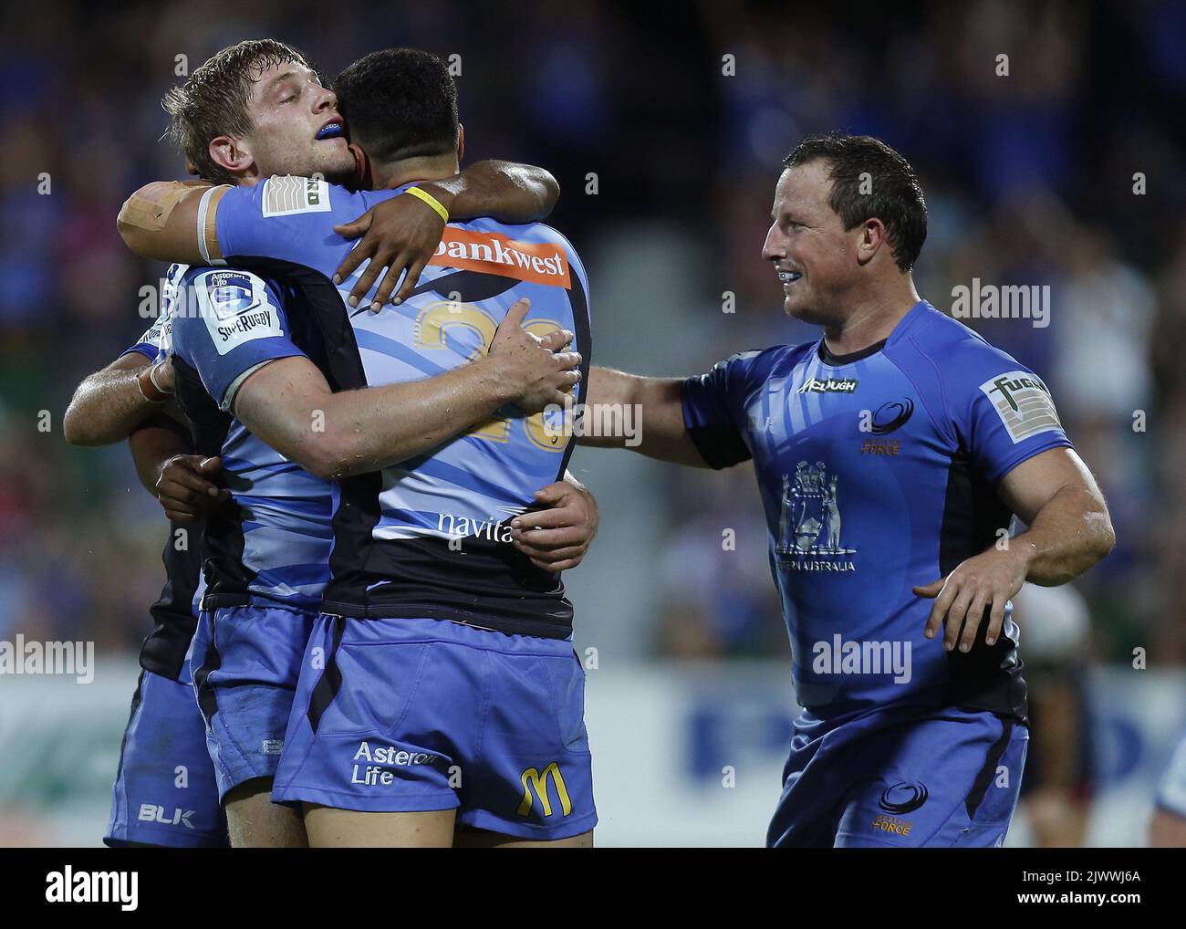 Forces Kyle Godwin is embraced by team mates after the completion of ...