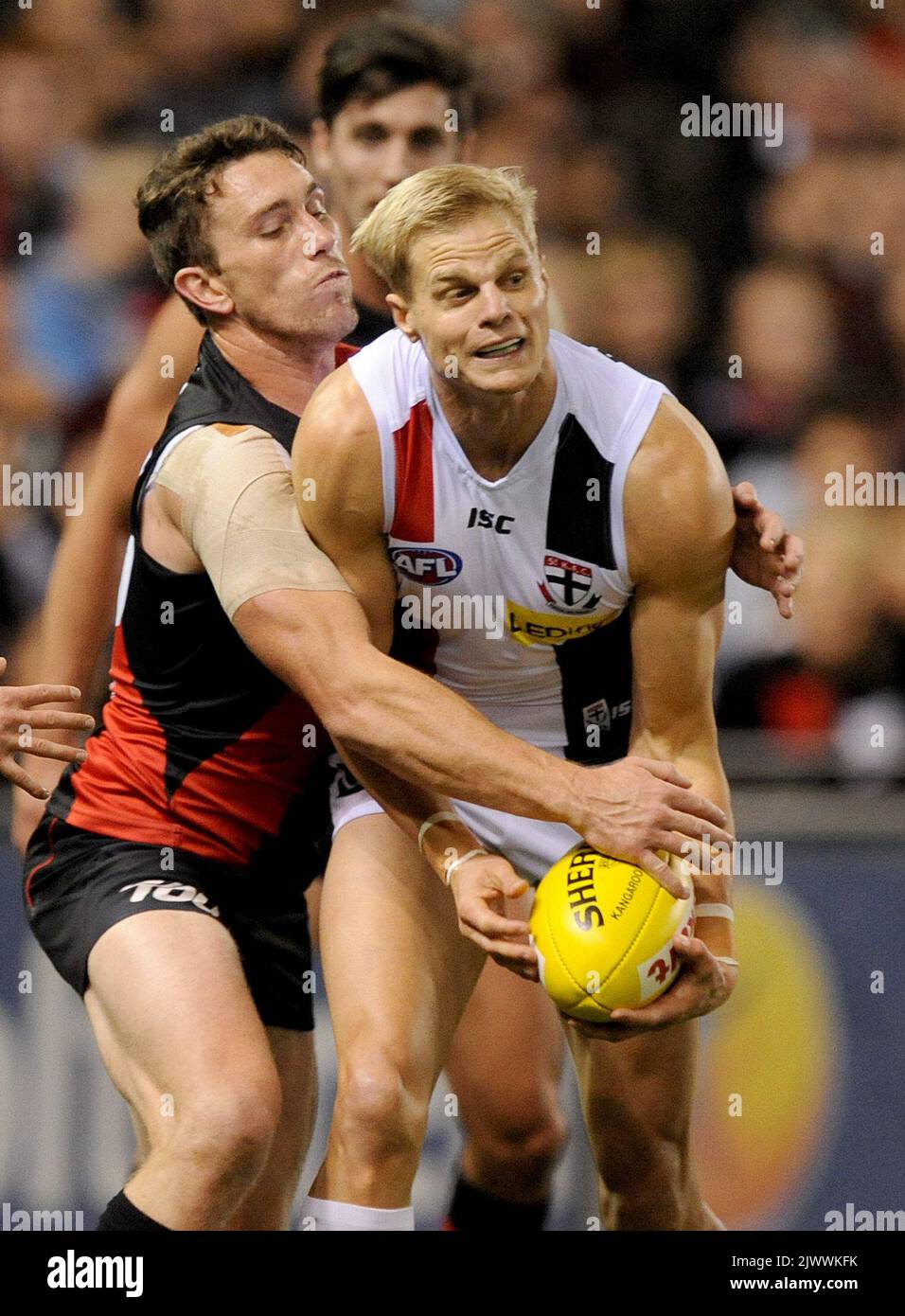 Nick Riewoldt of St Kilda is tackled by Heath Hocking of Essendon ...