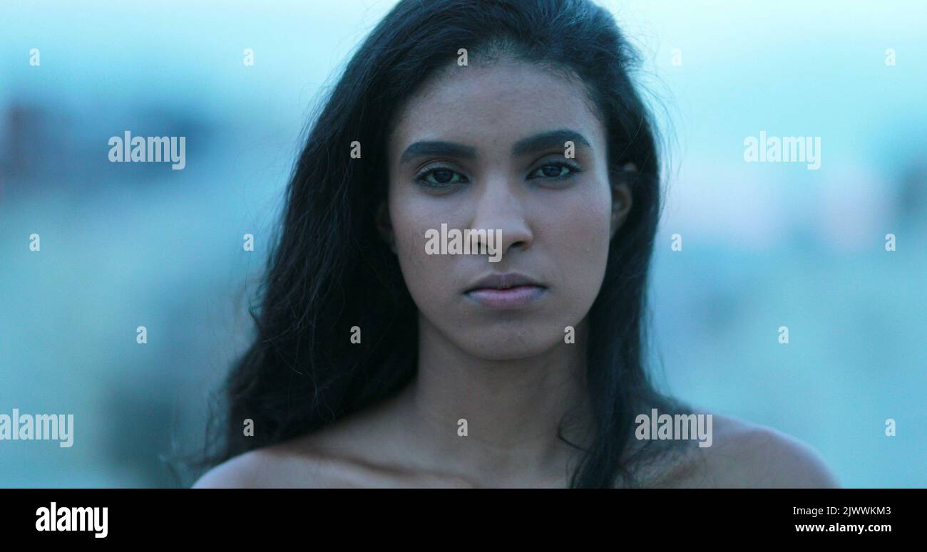 Serious dramatic black girl portrait looking to camera. Young African ...