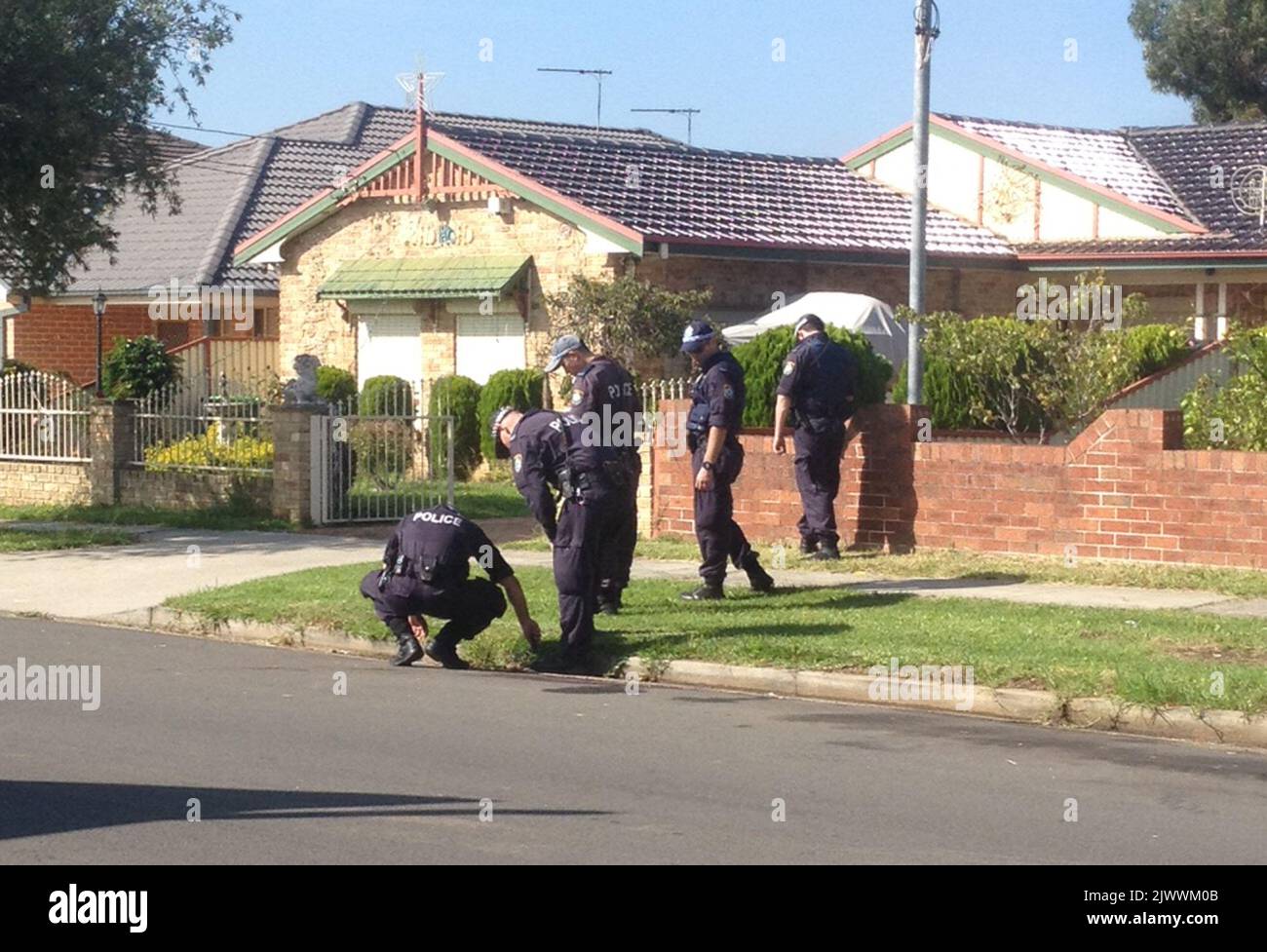 Police search for evidence in the Western Sydney suburb of Yagoona ...