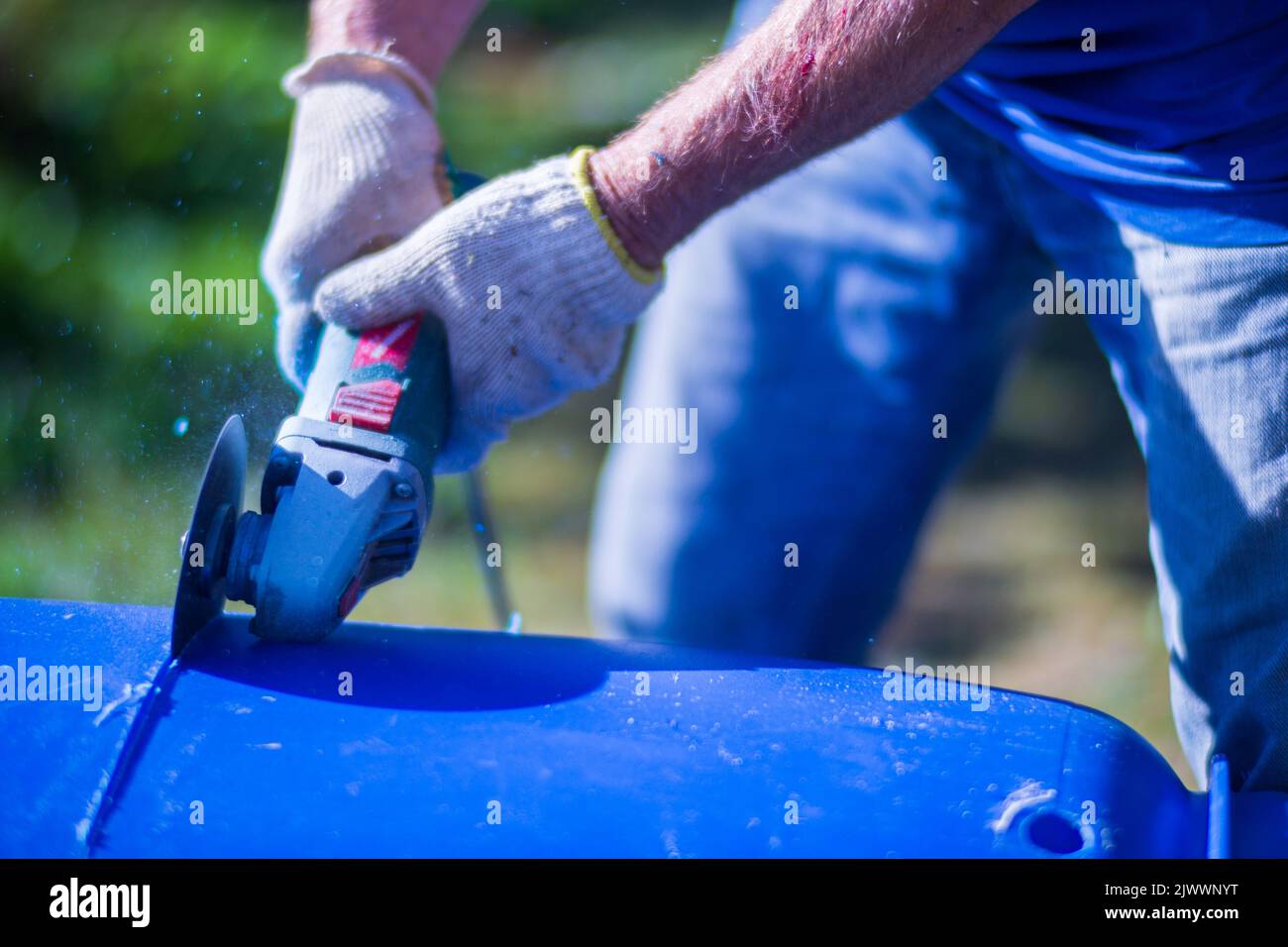 Man working with grinder saw, close up view on tool. Electric saw and ...