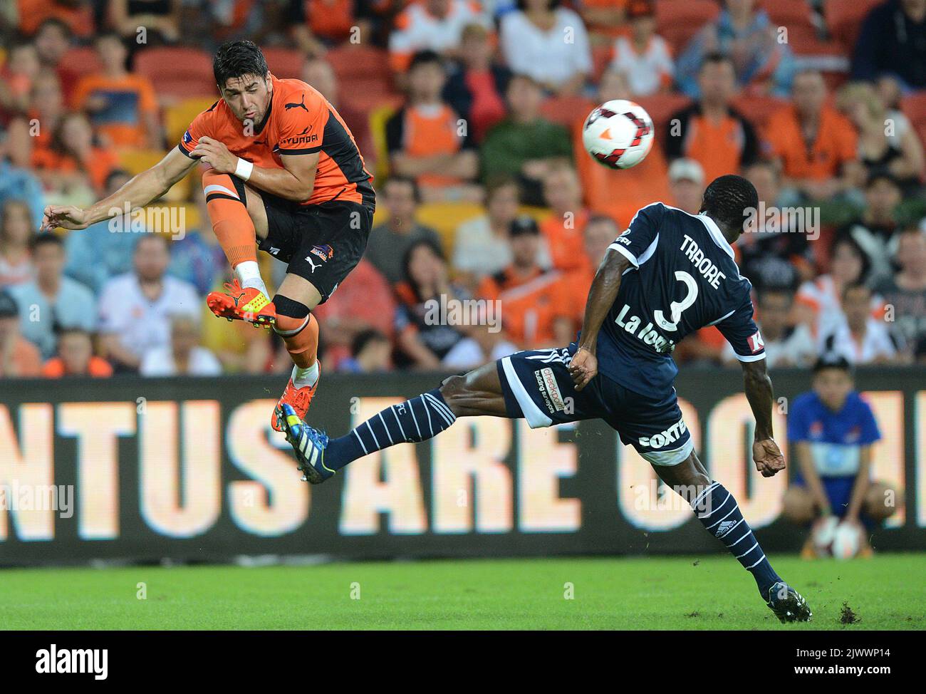 Roar player Dimitri Petratos competes with Victory player Adama Traore ...