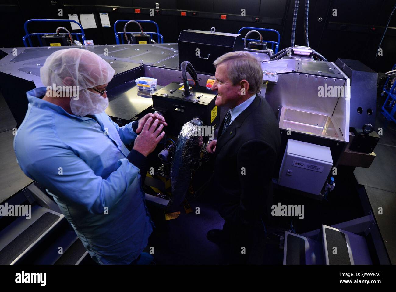 Industry minister Ian Macfarlane listens to electrical engineer Robert Brookfield at the HERMES ...