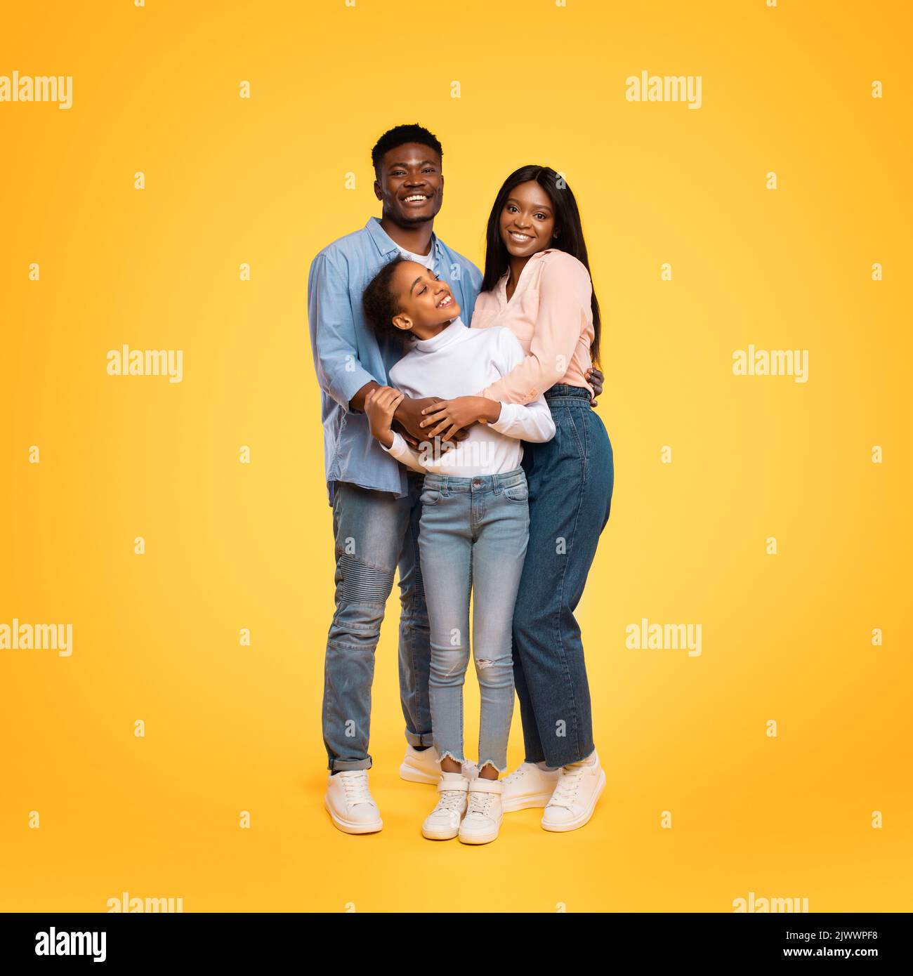 Happy family. Young african american parents with pretty daughter ...