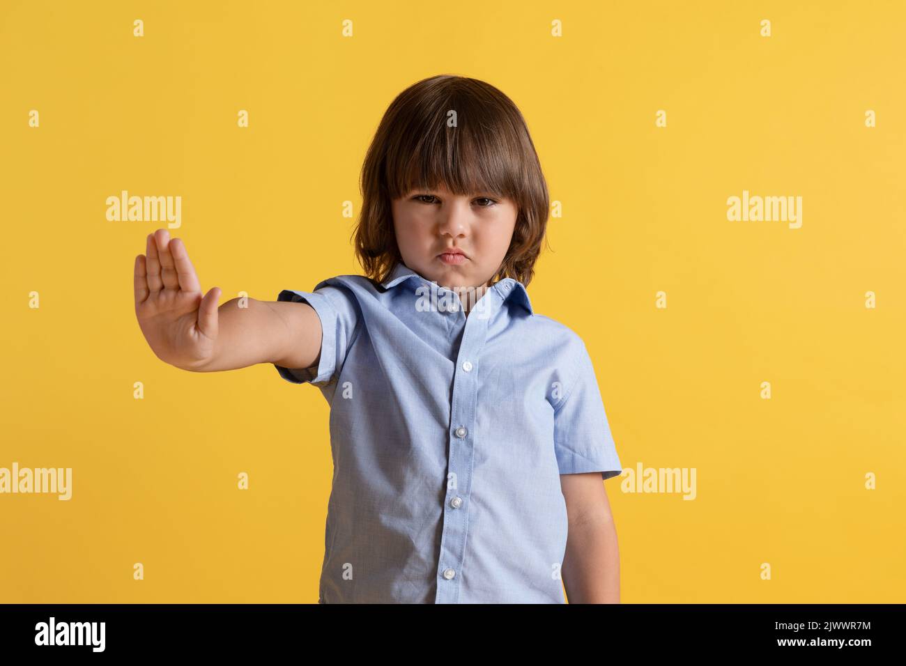 No, bad idea. Studio portrait of cute displeased little boy frowning ...