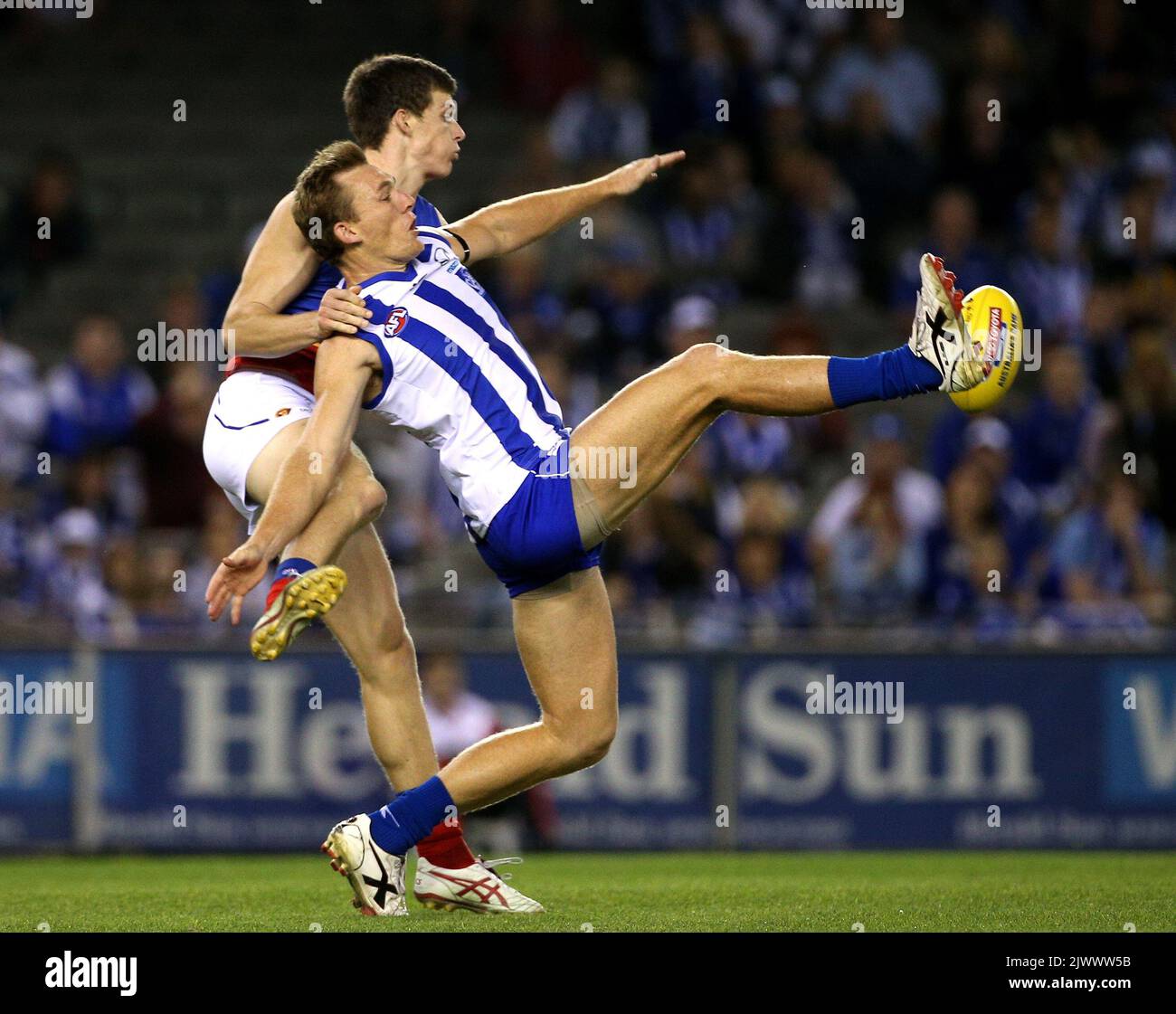 Drew Petrie of the Kangaroos is dragged off the marking contest by ...