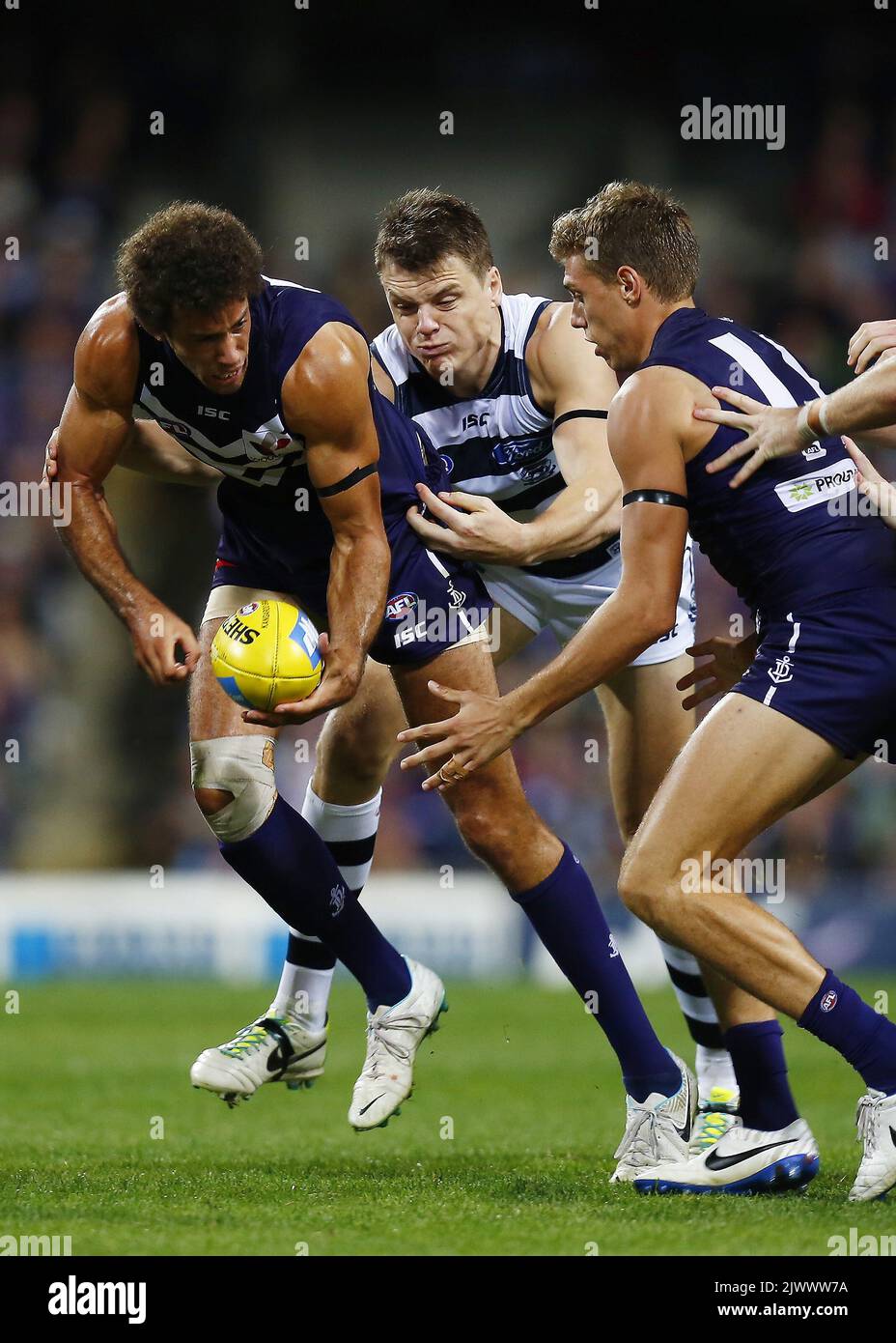 Zac Clarke of Fremantle gets his handball away during the Round 9 AFL ...