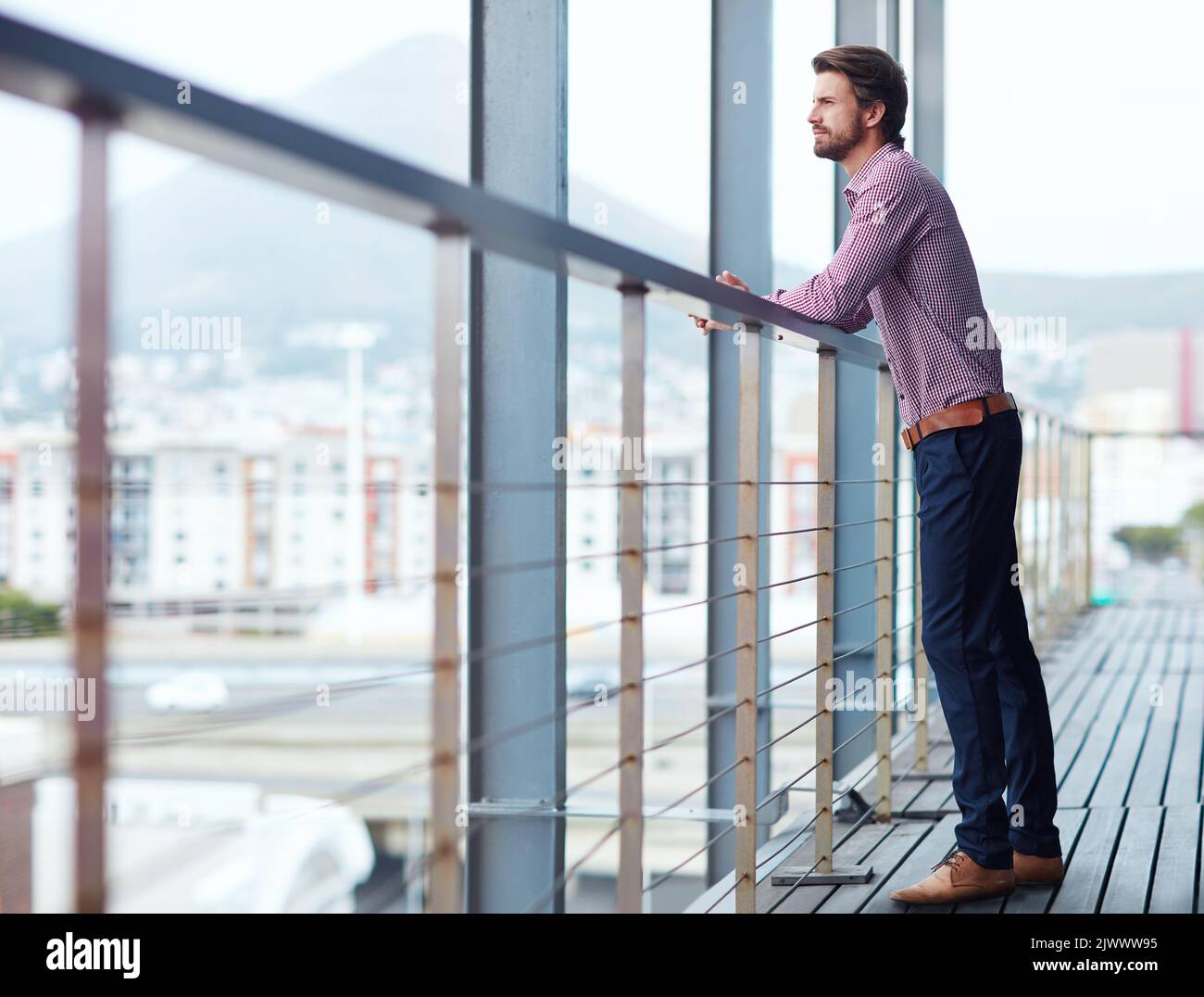 Pause for thought. a thoughtful young businessman standing on the ...