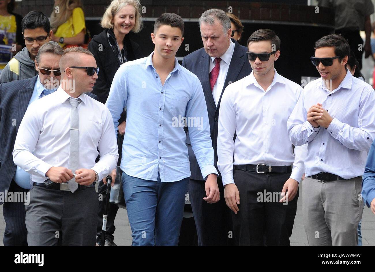 Liam Knight (2nd left), surrounded by family and friends, arrives at ...
