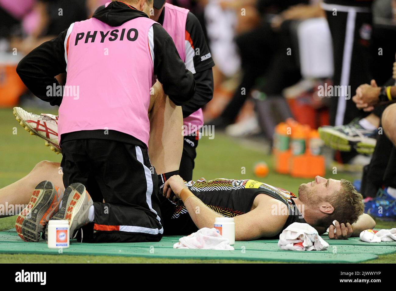 Luke Delaney of St Kilda gets treatment for an injury, during the Round ...