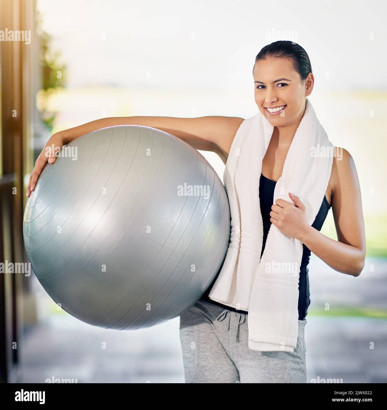 Smiling because Im fit. Cropped portrait of a young woman carrying her ...