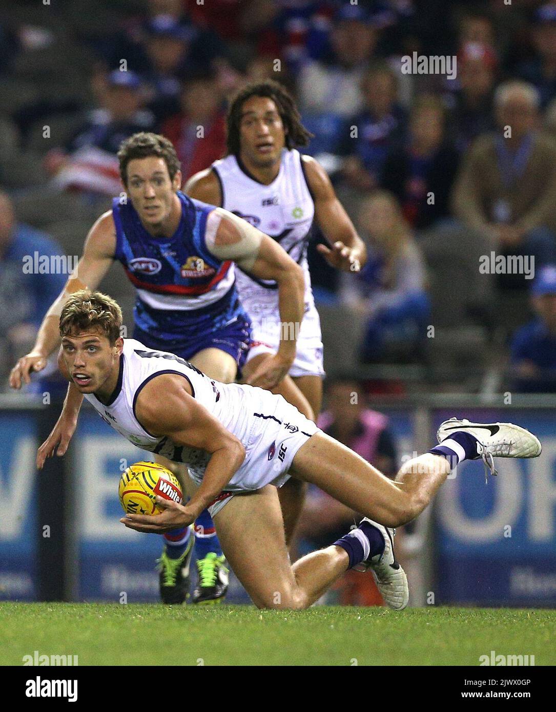 Tom Sheridan of the Dockers handballs during the Round 11 AFL match ...