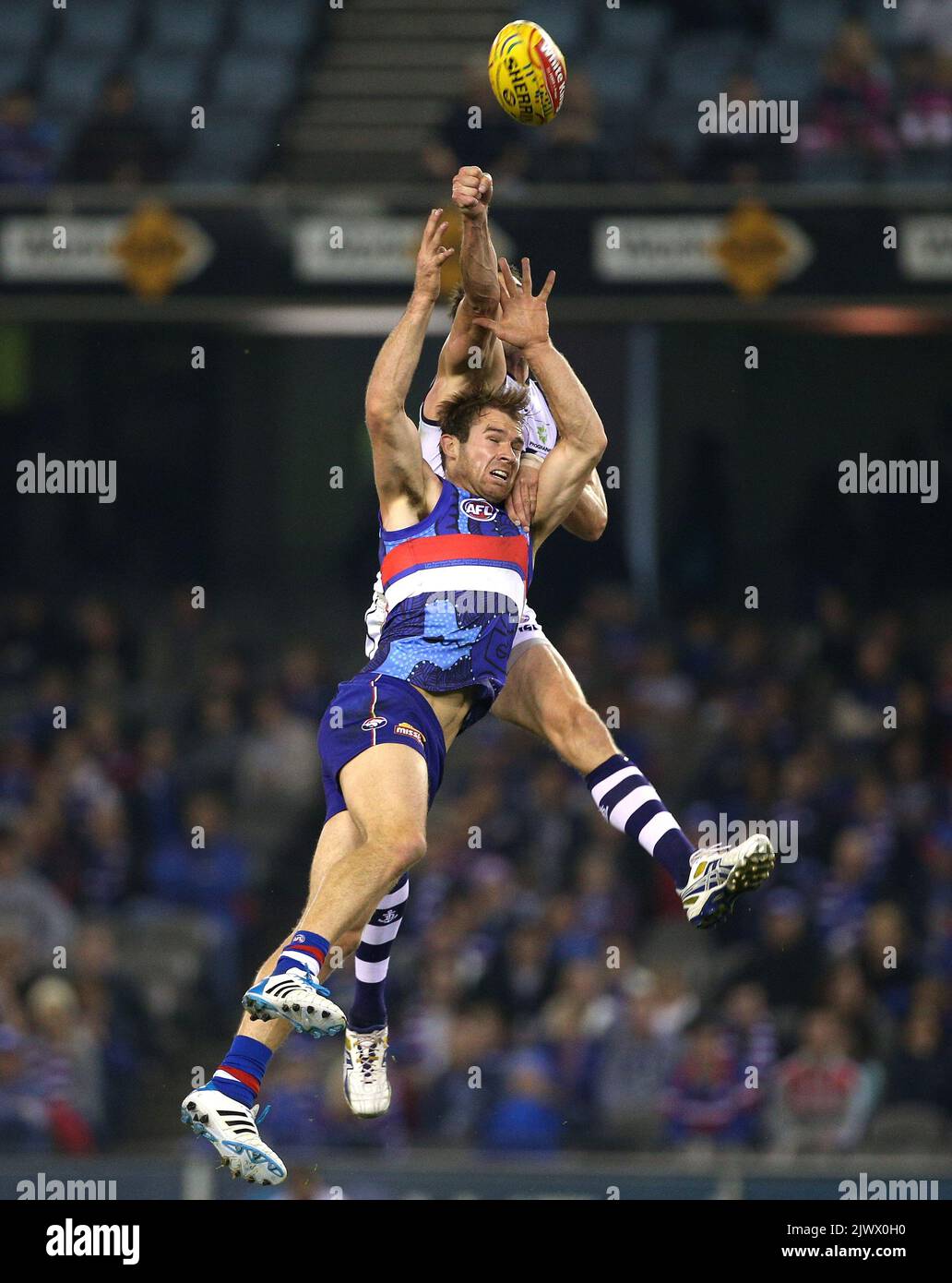 Stewart Crameri of the Bulldogs flies with Luke McPharlin of the ...