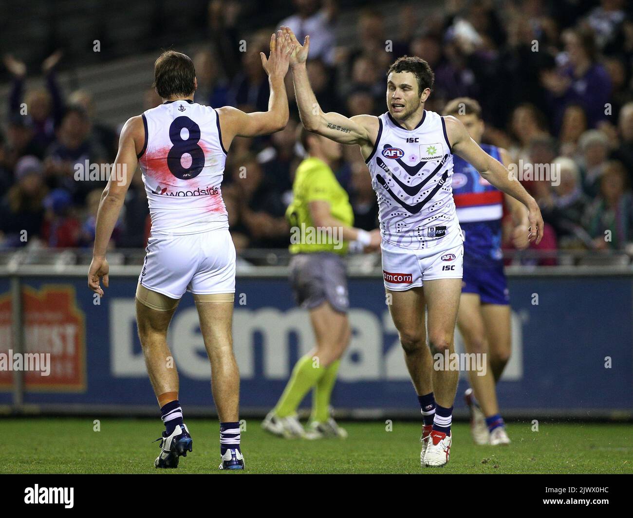 Hayden Ballantyne of the Dockers celebrates a goal with Nick Suban ...