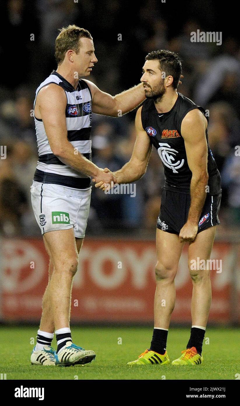 A dejected Kade Simpson of Carlton shakes hands with Steve Johnson of ...
