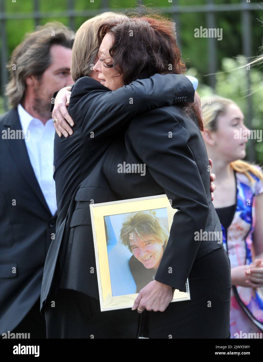 Former Masters Apprentices bass player Glenn Wheatley hugs Karin Keays ...