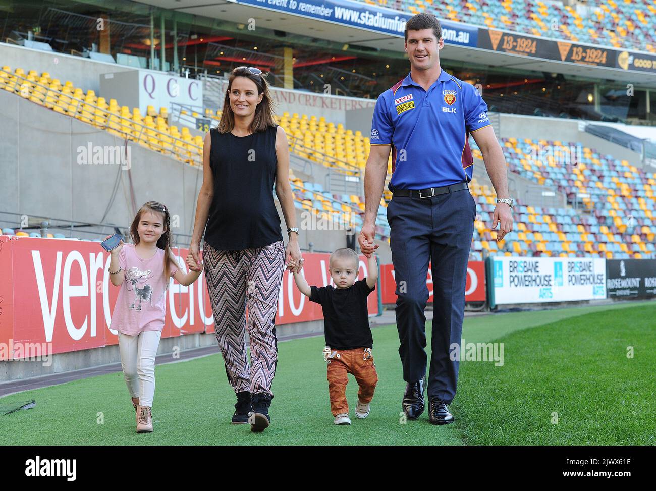 Brisbane Lions player Jonathan Brown walks with his family L to R ...