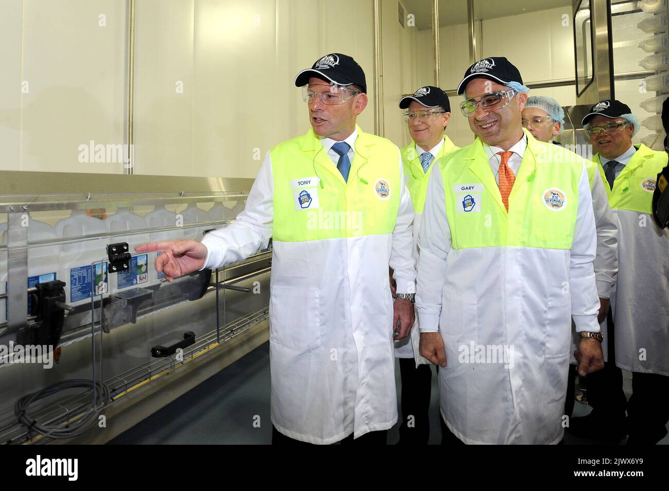 Prime Minister Tony Abbott is given a guided tour of the new Devondale ...