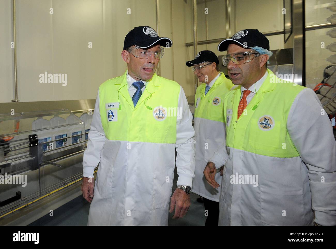 Prime Minister Tony Abbott is given a guided tour of the new Devondale ...