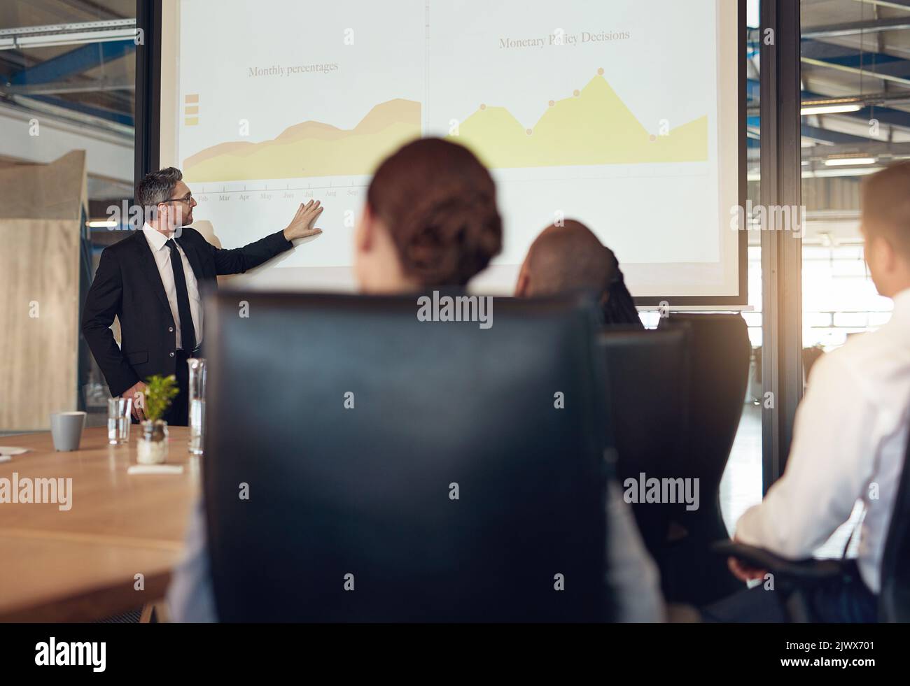 He has everyones attention in the meeting. an executive giving a ...