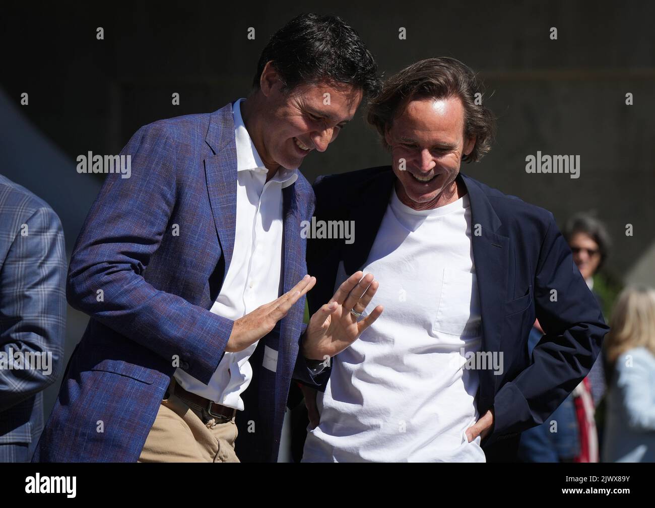 Real estate developer Ian Gillespie, right, founder of Westbank, jokes ...