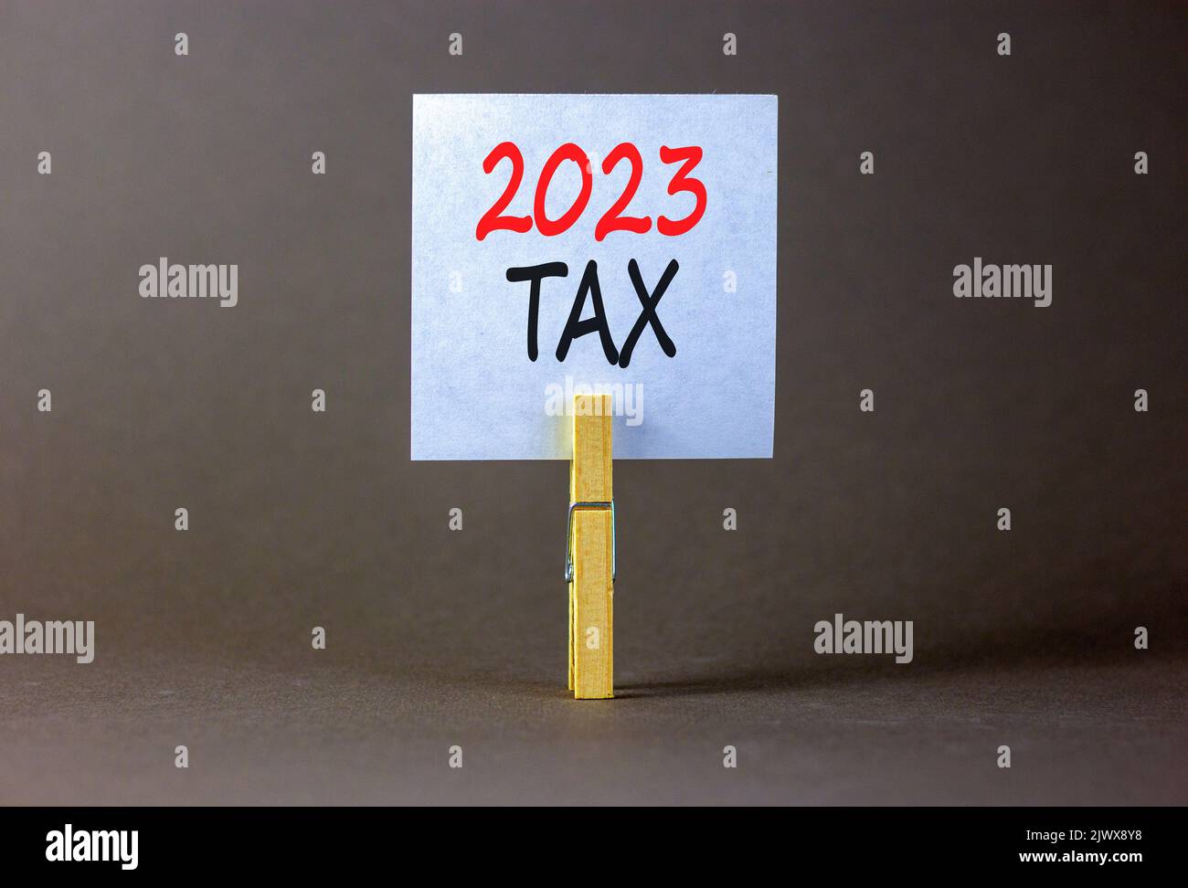 2023 tax new year symbol. White paper with words 2023 tax, clip on ...
