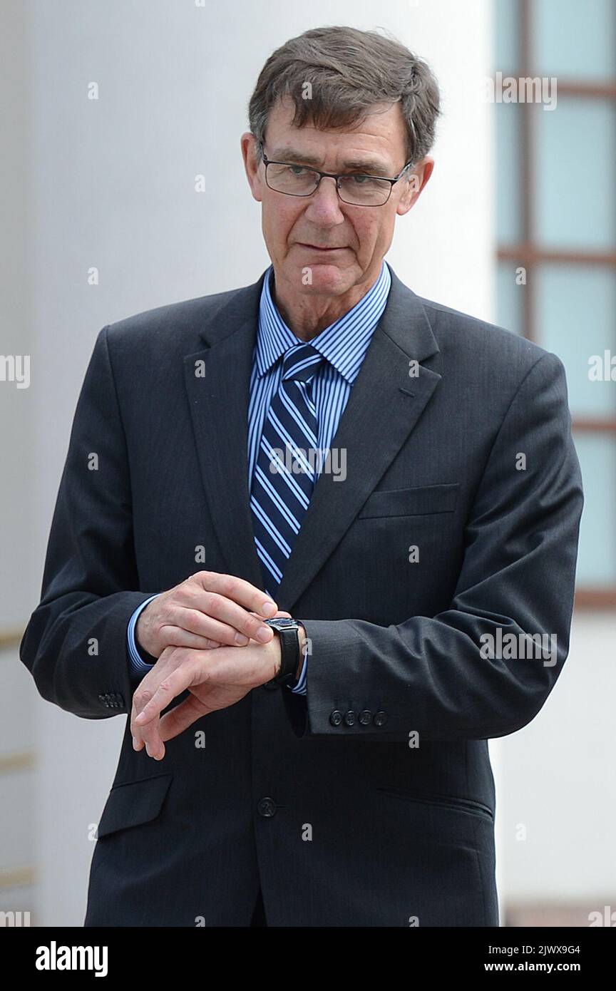Australia's special envoy Angus Houston looks on after leaving a ramp ...
