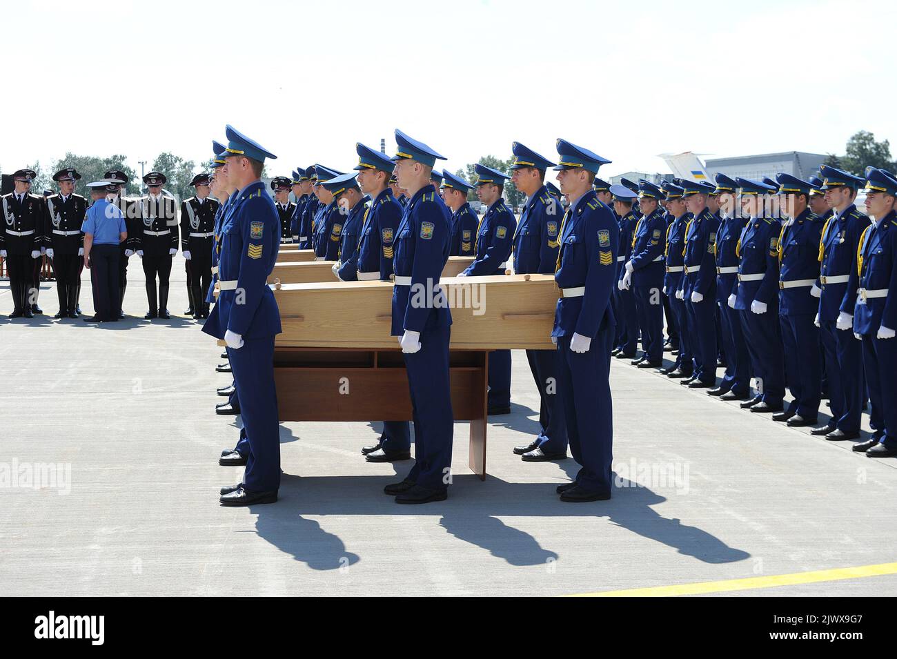Ukrainian military students stand with bodies during a ramp ceremony at ...
