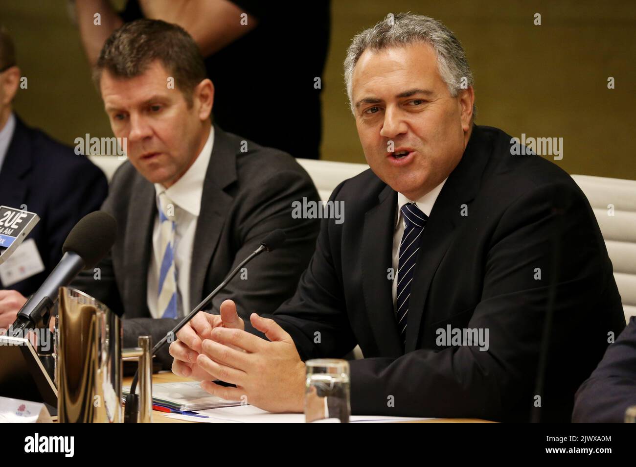 Federal Treasurer Joe Hockey and NSW Premier Mike Baird address the ...