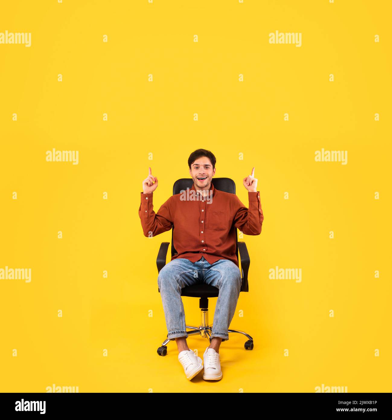 Happy male person pointing hi-res stock photography and images - Alamy