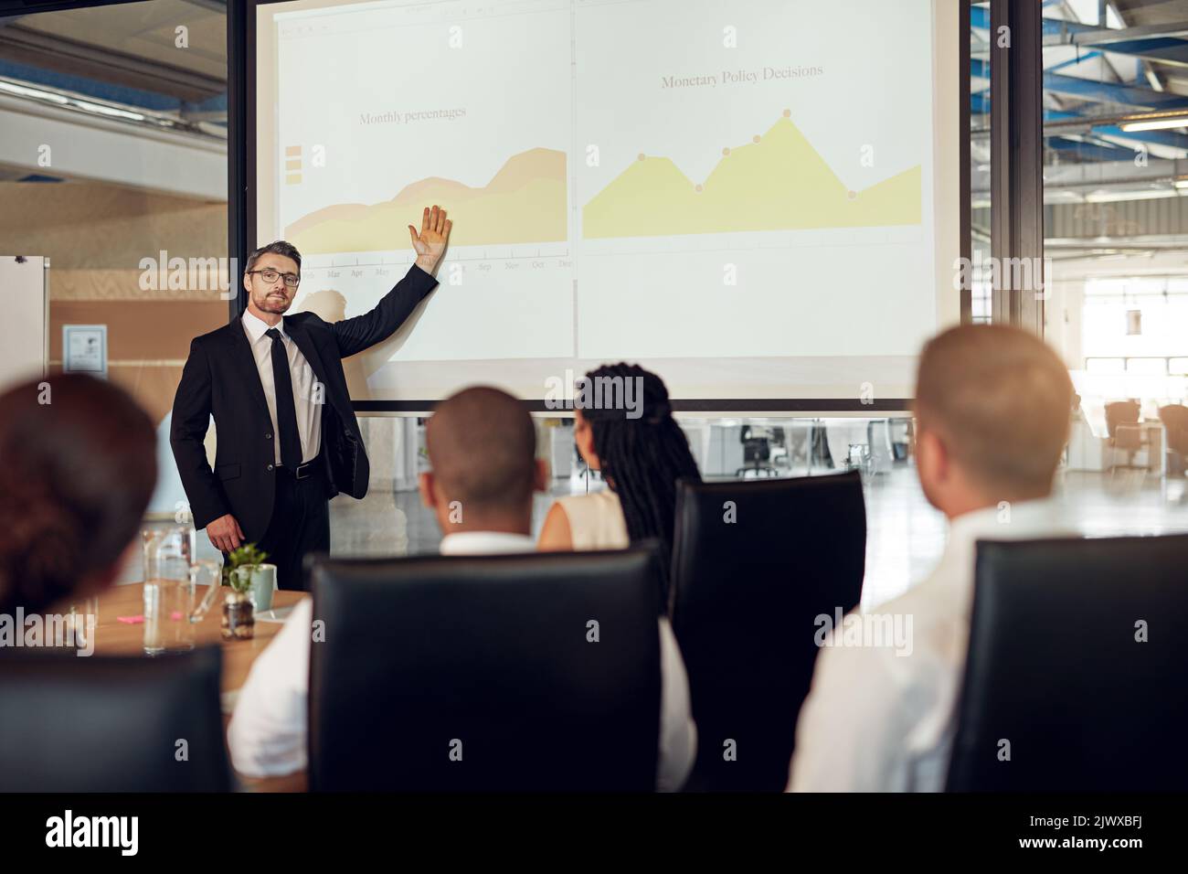 Explaining the figures clearly and concisely. an executive giving a ...