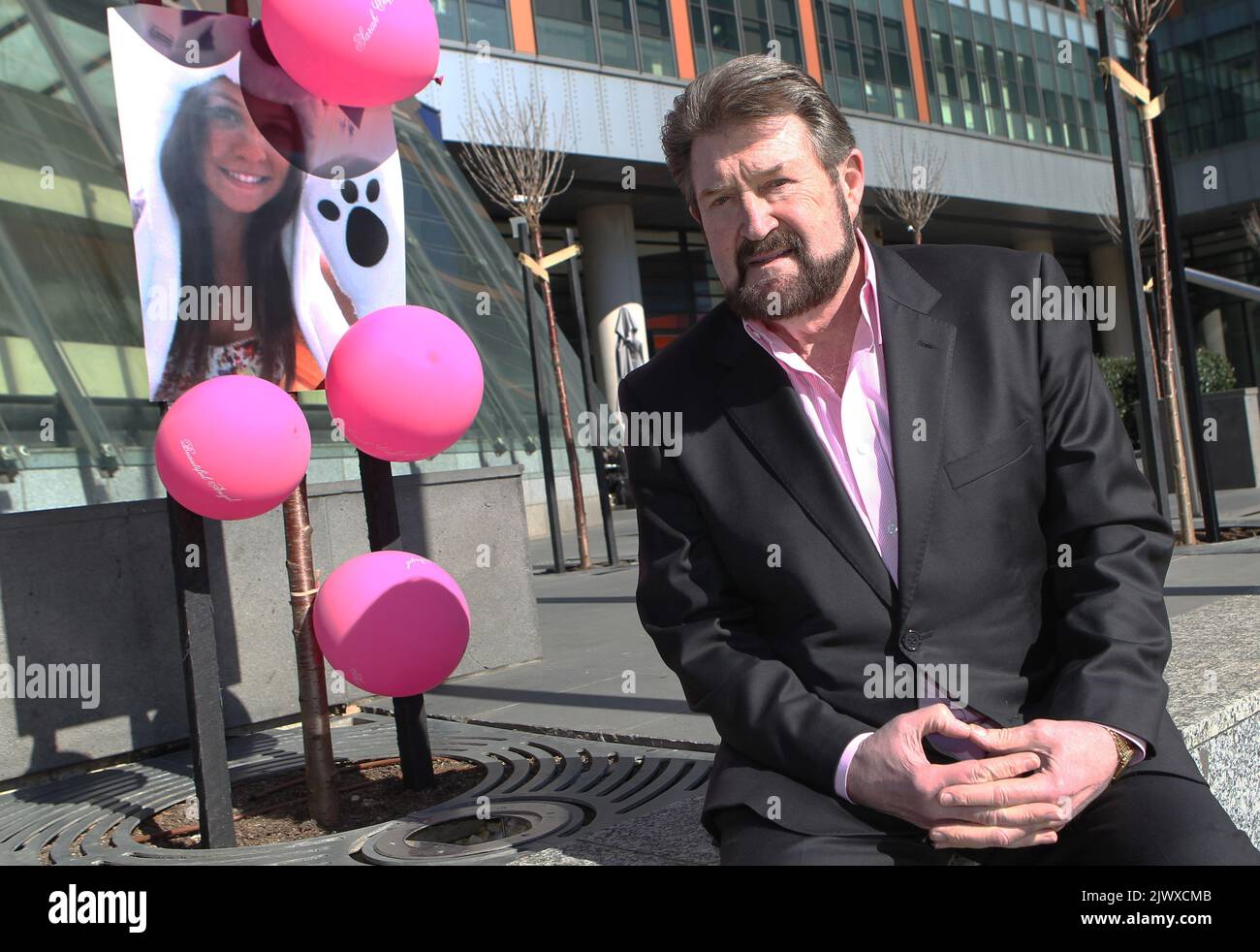 Derryn Hinch with a portrait of Sarah Cafferkey outside the Melbourne ...