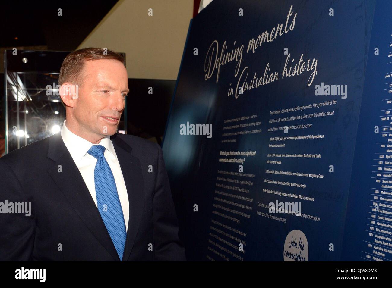 Prime Minister Tony Abbott looks through exhibits after he launched ...