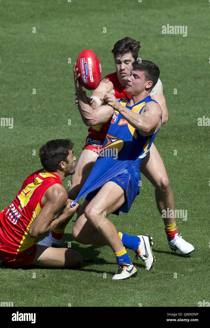 Eagles player Adam Carter is tackled during the Round 23 AFL match ...