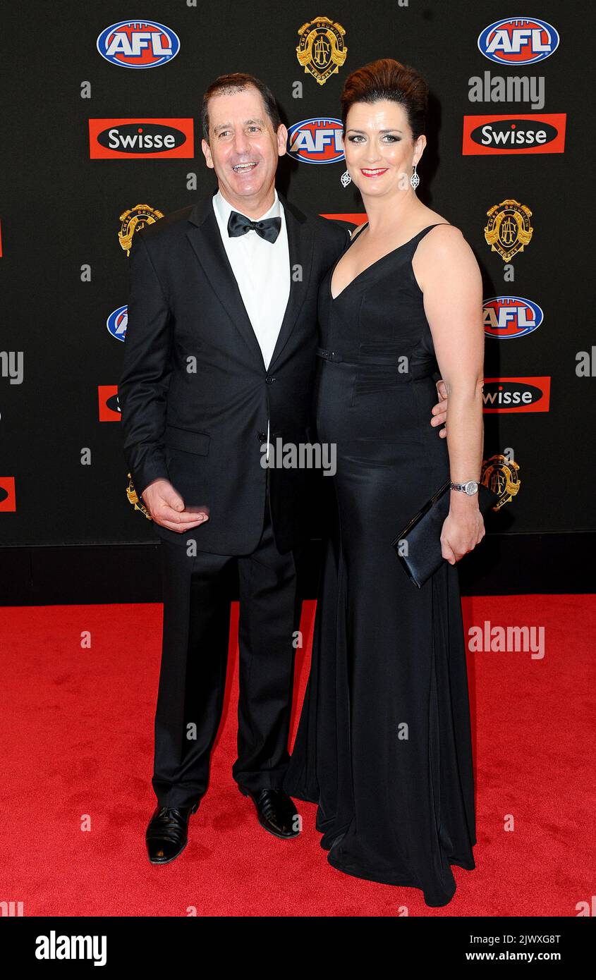 Fremantle coach Ross Lyon and wife Kirsten pose for photos on the red ...