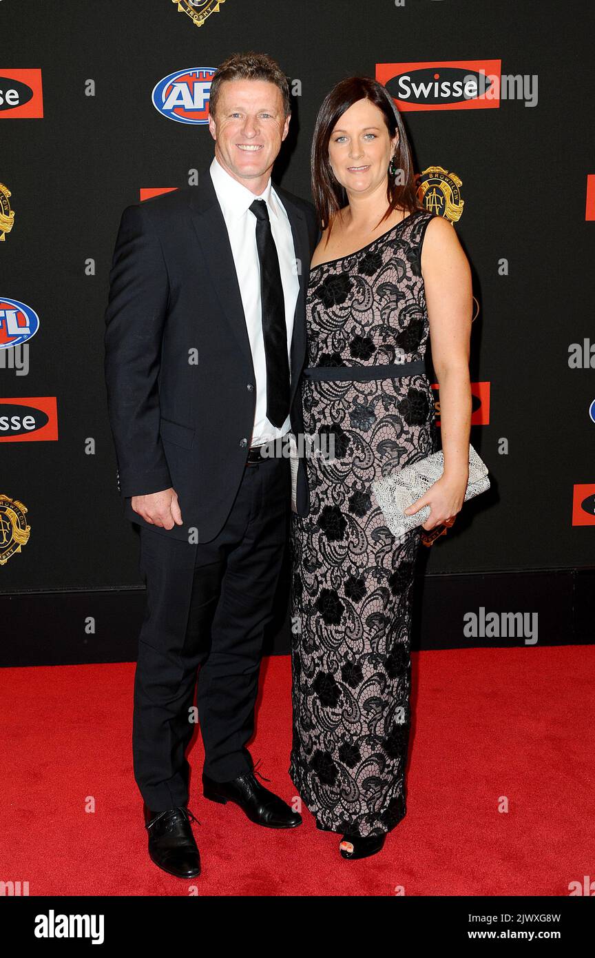 Richmond coach Damien Hardwick and wife Danielle pose for photos on the ...