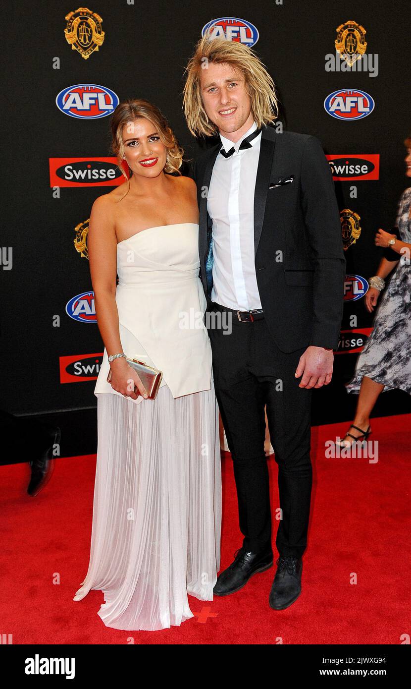 Dyson Heppell of Essendon and partner Kate Turner pose for photos on ...