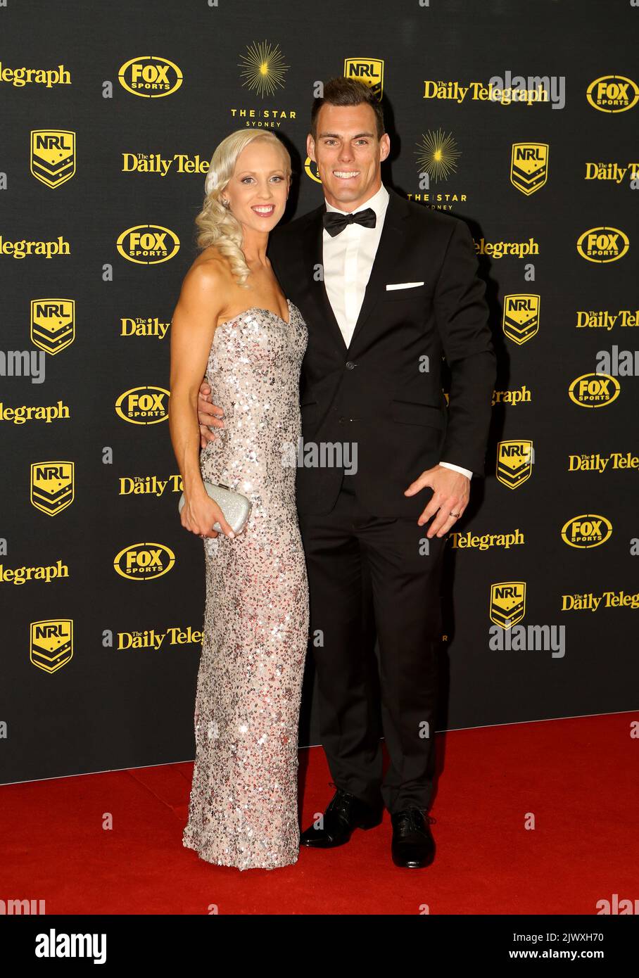 Retired Cronulla-Sutherland Sharks player John Morris and his wife ...