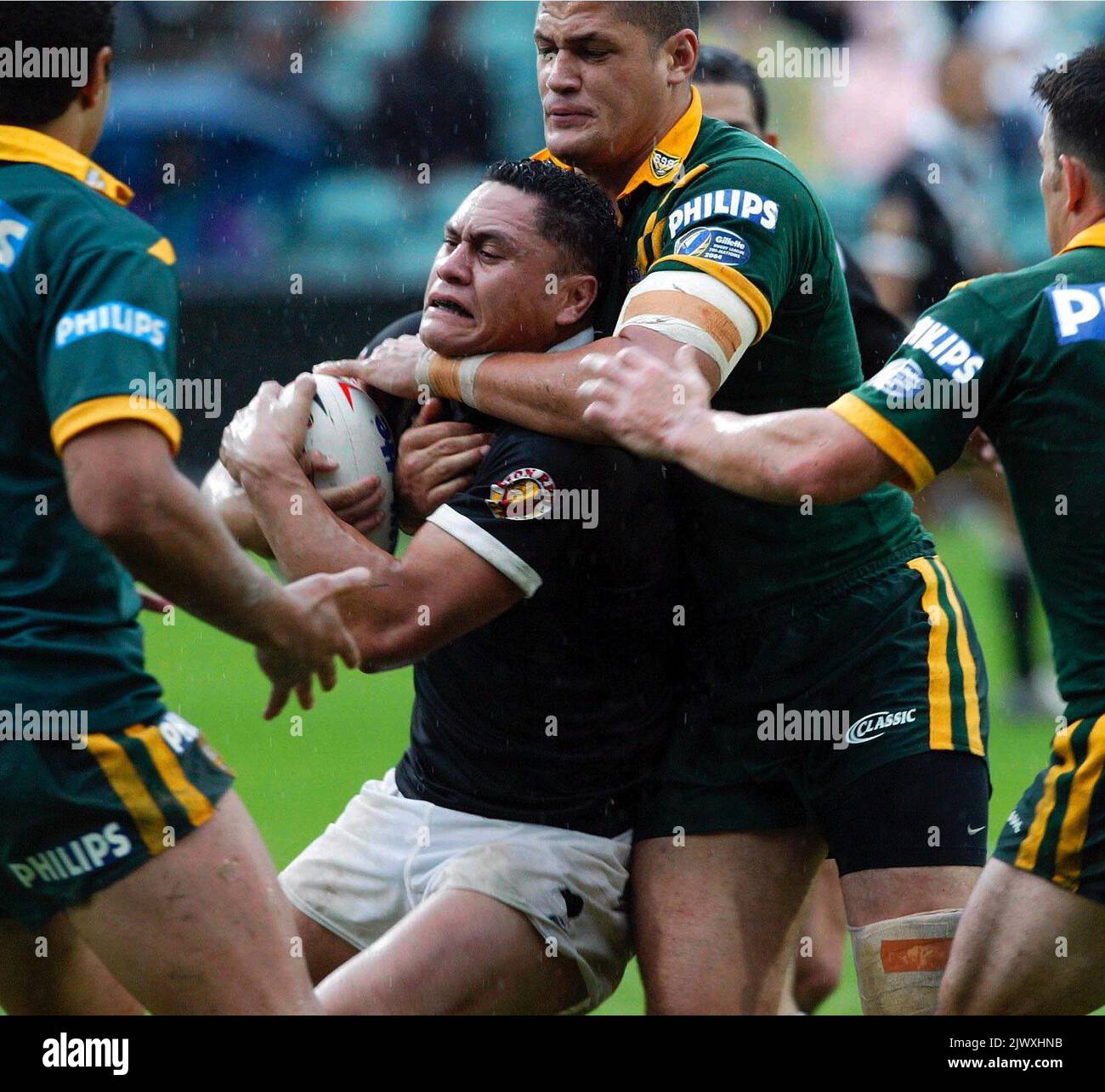 New Zealand's David Kidwell is tackled by Willie Mason during the Rugby ...