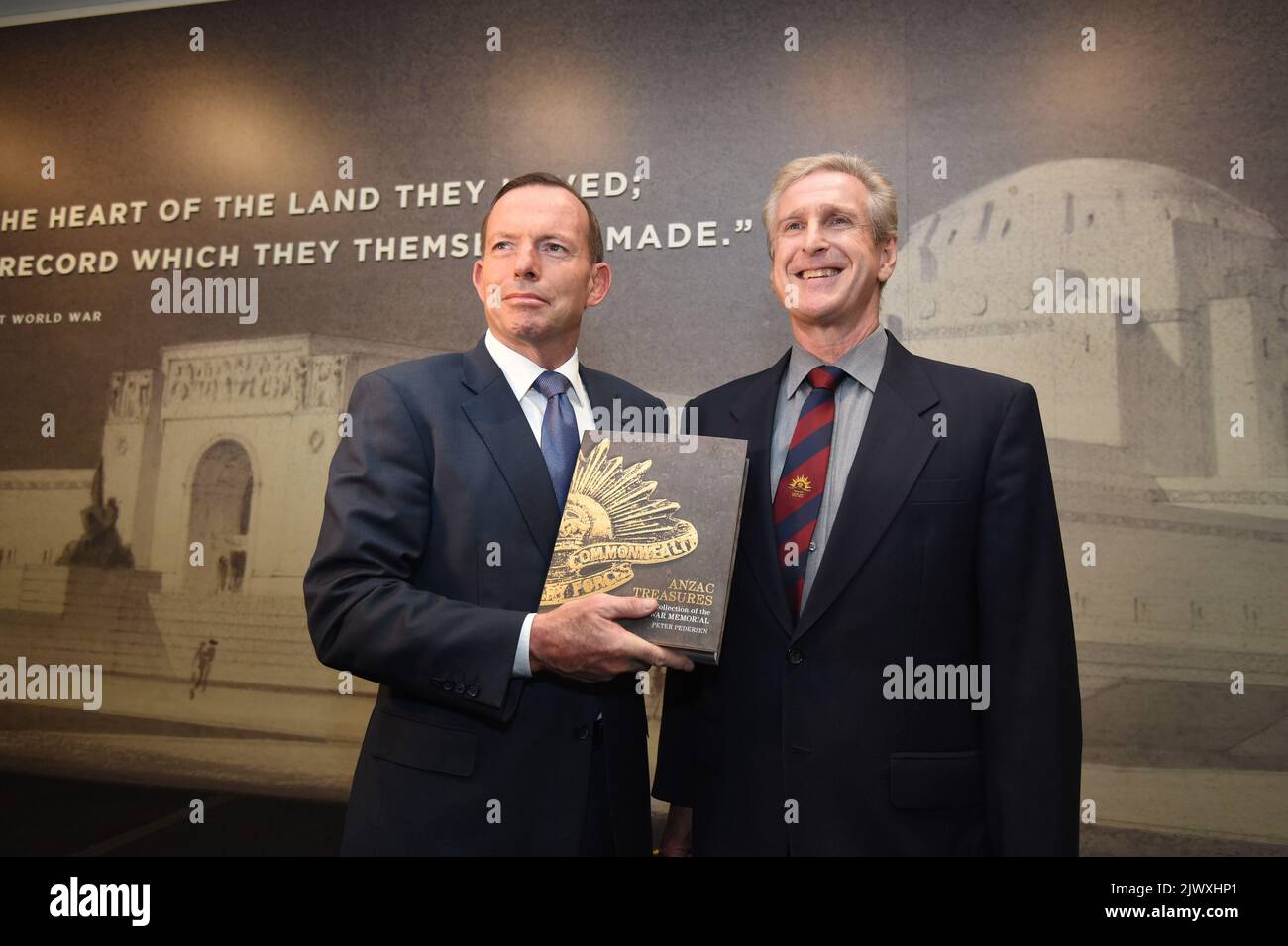 Prime Minister Tony Abbott poses for photographs with author Peter ...
