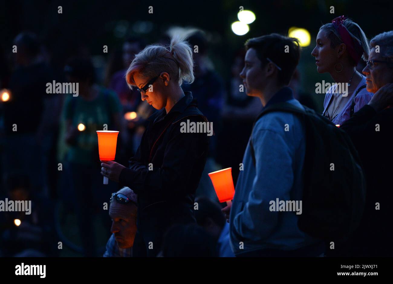 People attend a vigil for murdered transgender woman Mayang Prasetyo in ...