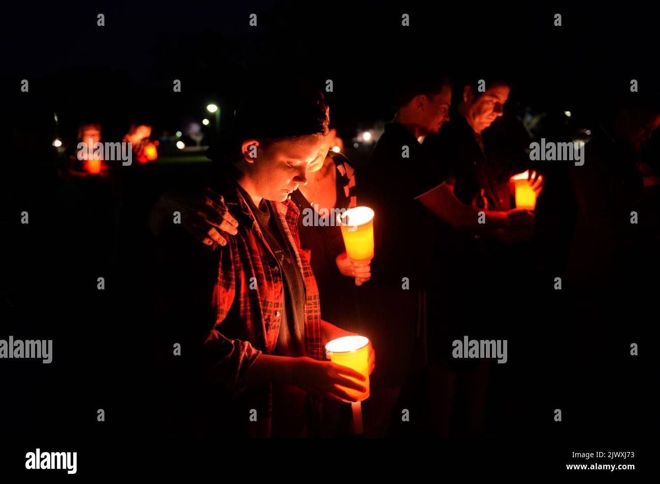 People attend a vigil for murdered transgender woman Mayang Prasetyo in ...