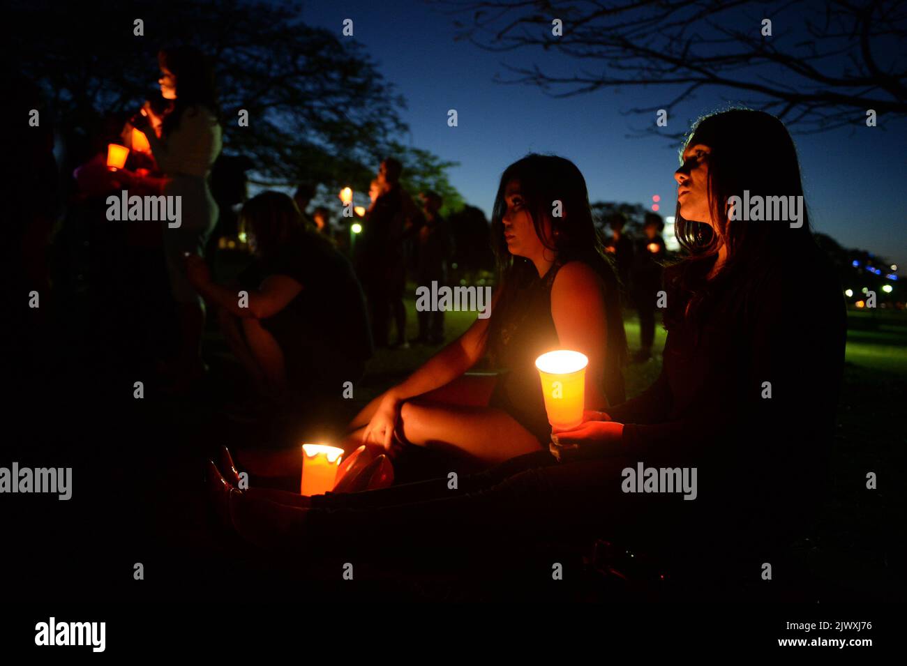 People attend a vigil for murdered transgender woman Mayang Prasetyo in ...