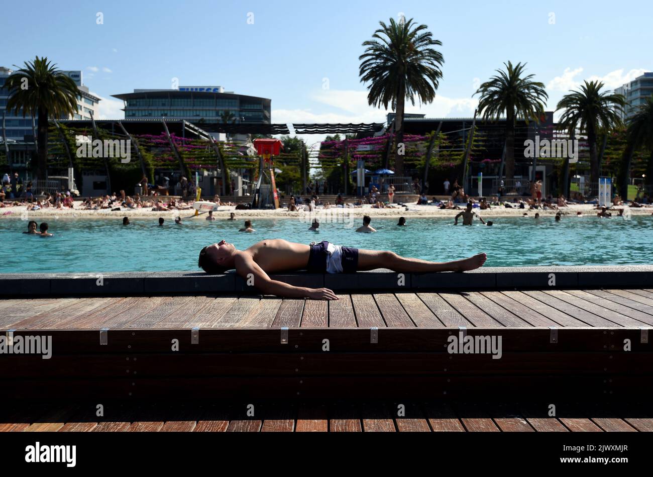 People escape the hot weather at South Bank beach in Brisbane, Monday ...