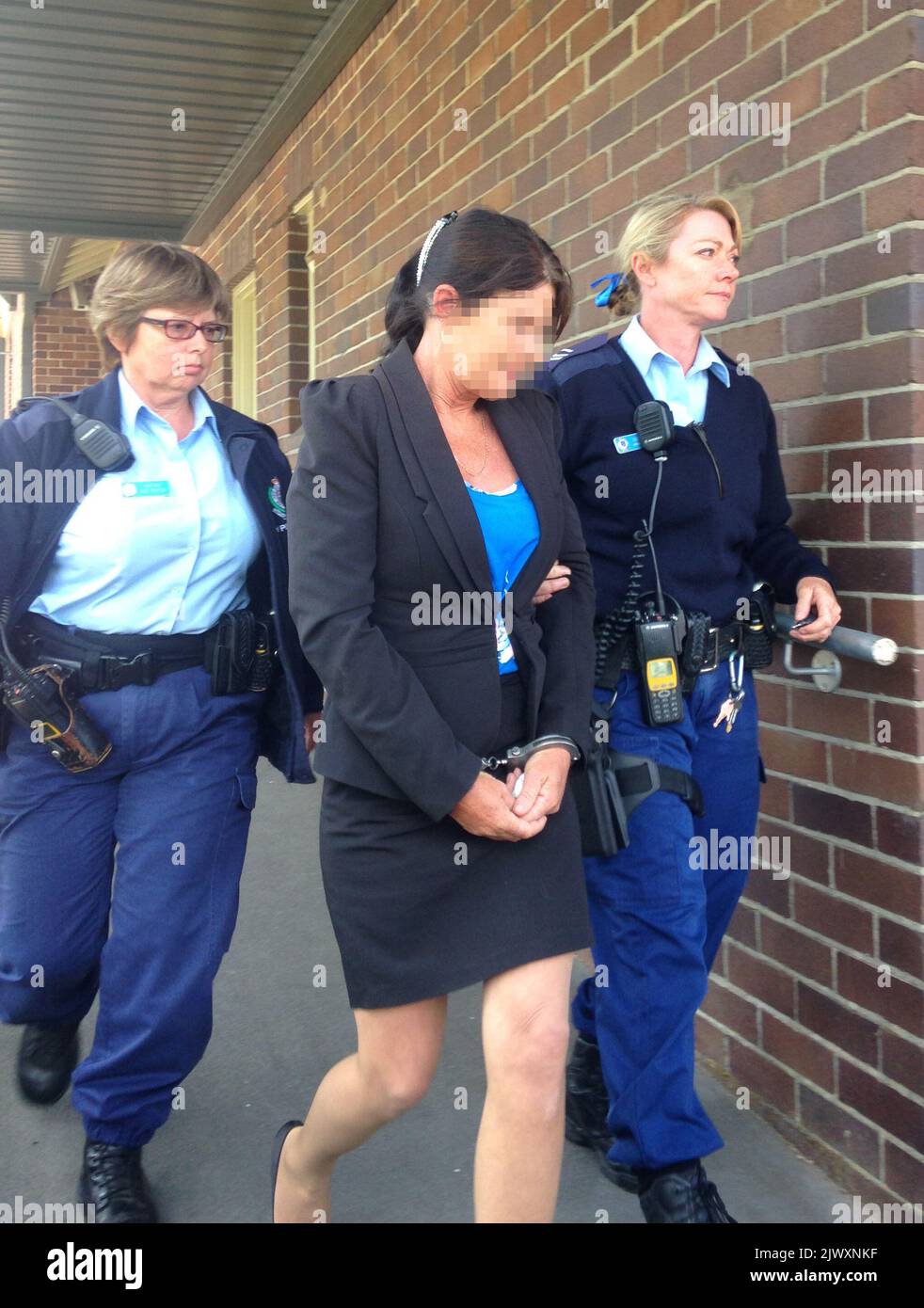 Betty Colt is led out of Moss Vale Local Court on Monday November 3 ...