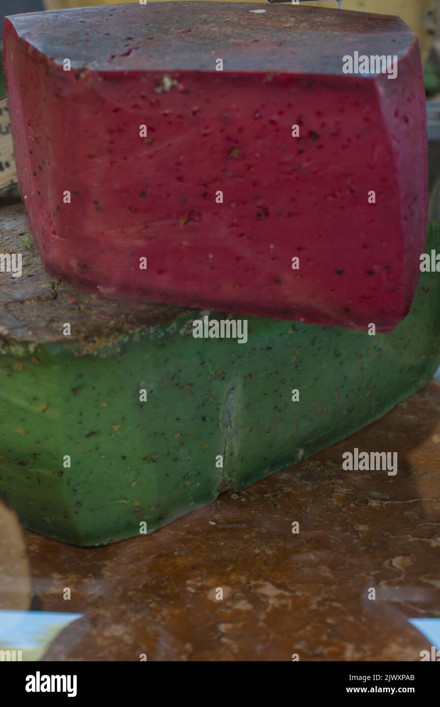 Assorted gourmet french cheese. Red and green color. Rennes Stock Photo ...